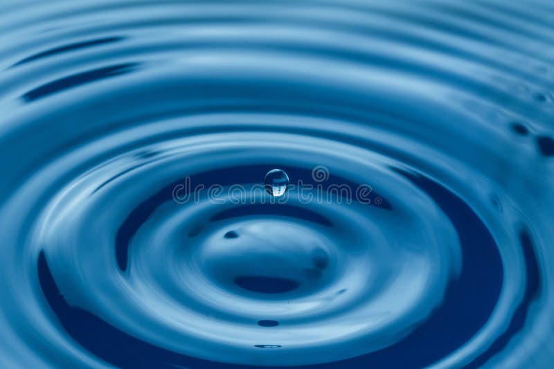 Clear Blue Pool of Water with Droplets in the Center Stock Photo ...