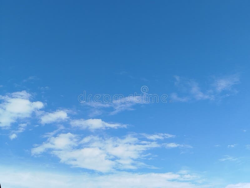 A Clear Blue Sky with a Few Scattered White Clouds, Creating a Peaceful ...