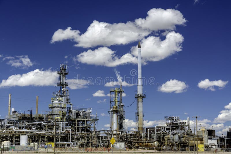 Clear Blue Sky and an Oil Refinery Stock Image - Image of power, clouds ...