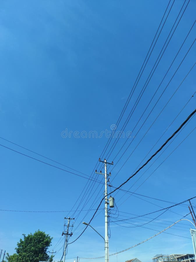 Clear Blue Sky with Power Lines and Poles, Capturing Urban Calm and ...