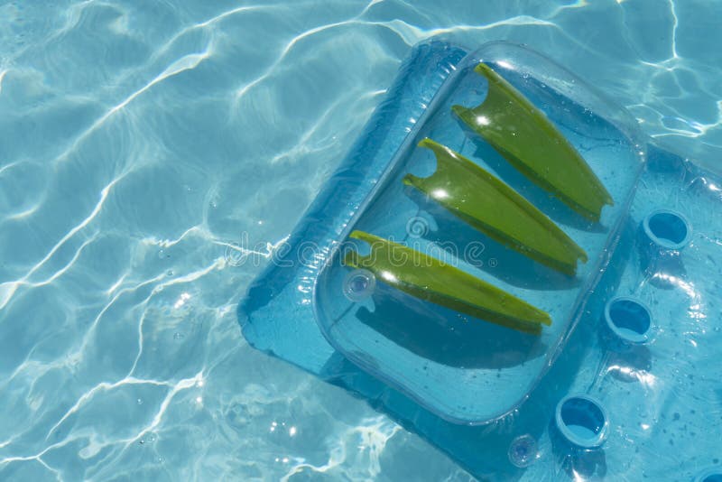 Clear Blue Summer Pool Lounger Float on a Rippled Swimming Pool Stock ...