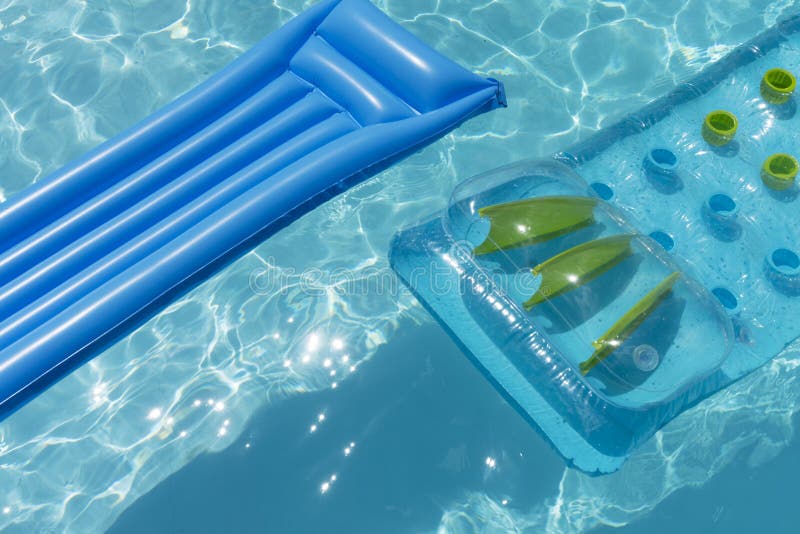 Clear Blue Summer Pool Lounger Float on a Rippled Swimming Pool Stock ...
