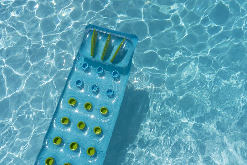 Clear Blue Summer Pool Lounger Float on a Rippled Swimming Pool Stock ...