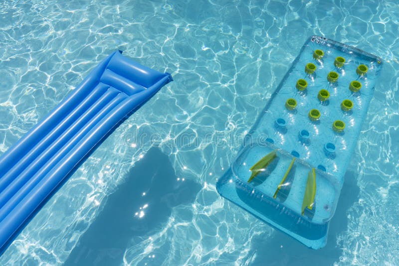 Clear Blue Summer Pool Lounger Float on a Rippled Swimming Pool Stock ...