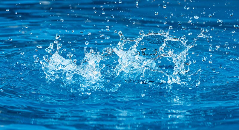 Clear Blue Water Splashes Dramatically in the Air, Creating Dynamic ...