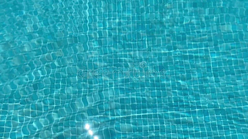 Clear Blue Water in a Swimming Pool with Gentle Ripples Creates a ...