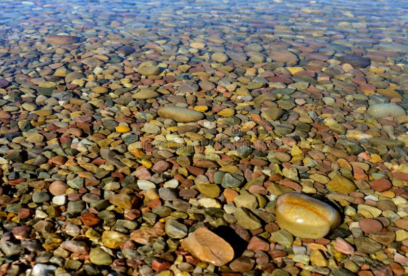 The Clear Blue Waters of Yellowstone Show Hidden Rocks. Stock Photo ...
