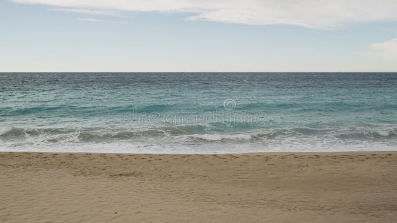 Clear Blue Waves with Strong Wind on a Sandy Empty Beach in Cannes in ...