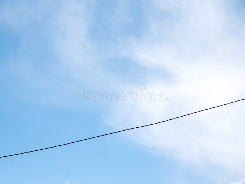 Clear Bright Blue Summer Sky, White Clouds and a One Single Electric ...