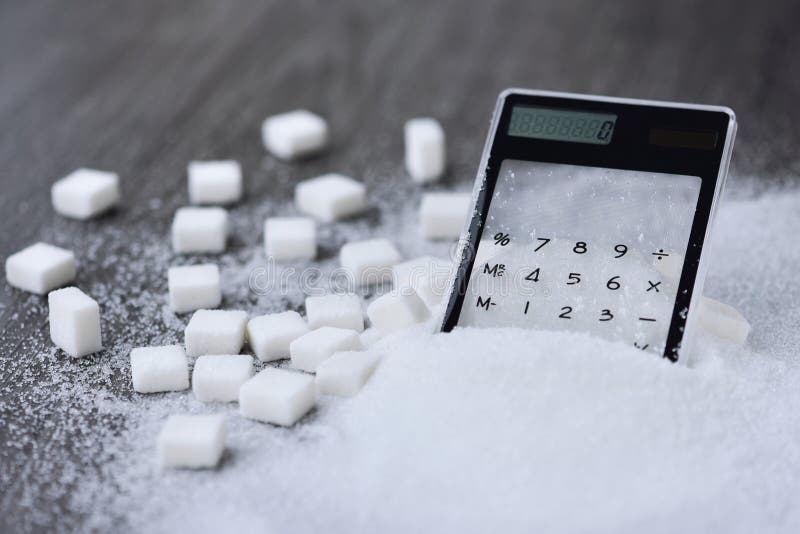 Clear Calculator on White Granulation Sugar and Cube Sugar Background ...