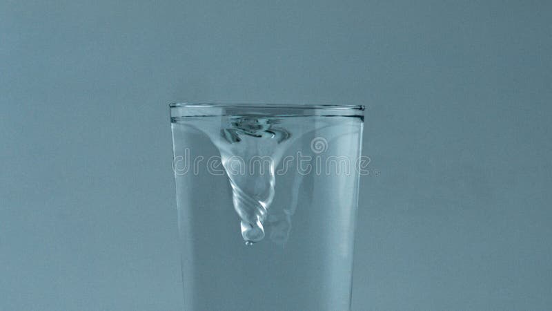 Clear Cold Water Vortex Inside Glass Container Closeup. Ice Cocktail ...