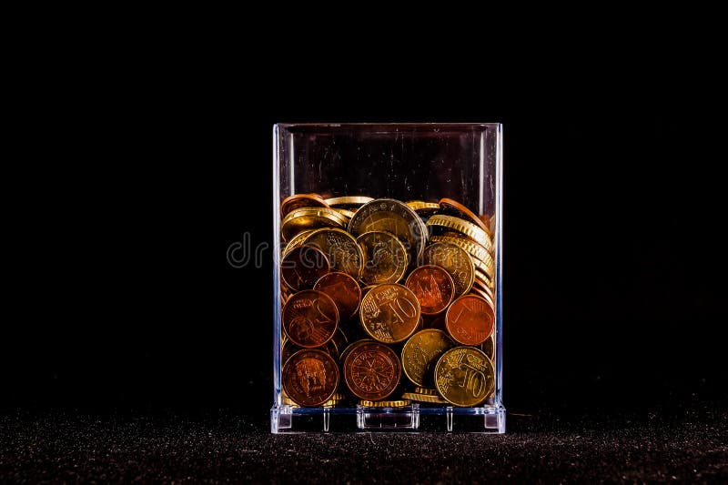 A Clear Container Filled with Gold Coins Stock Photo - Image of money ...