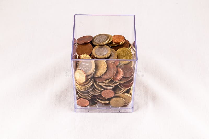A Clear Container Filled with a Variety of Coins Stock Image - Image of ...