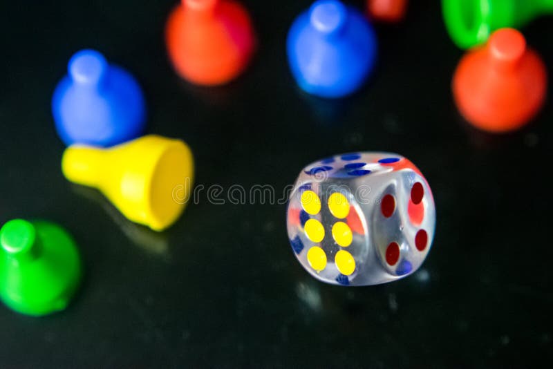 A Clear Dice and Tokens in a Reflective Surface Stock Photo - Image of ...