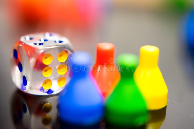 A Clear Dice and Tokens in a Reflective Surface Stock Photo - Image of ...
