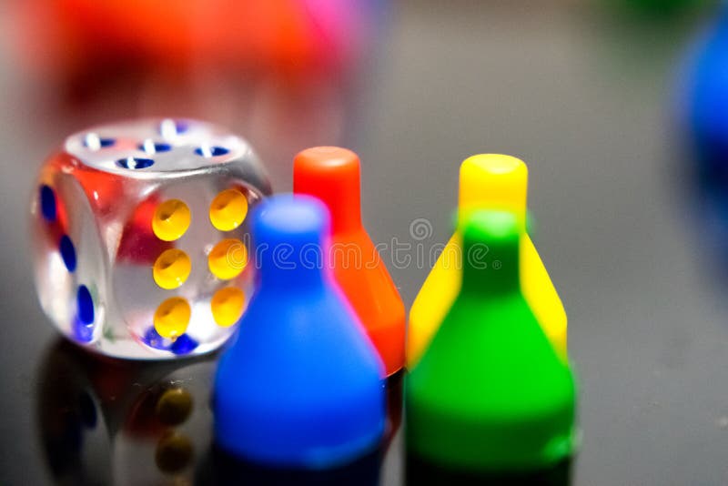 A Clear Dice and Tokens in a Reflective Surface Stock Photo - Image of ...