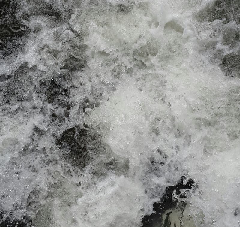 The Clear Foam of River Water Covered Most of the Large Rock Stock ...