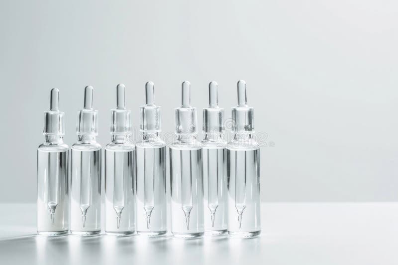 Clear Glass Bottles Displayed on a Table, Suitable for Various Concepts ...