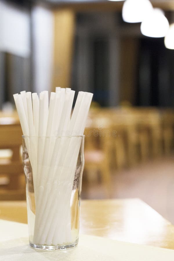 Glass Filled with Straws on a Restaurant Table Stock Image - Image of ...