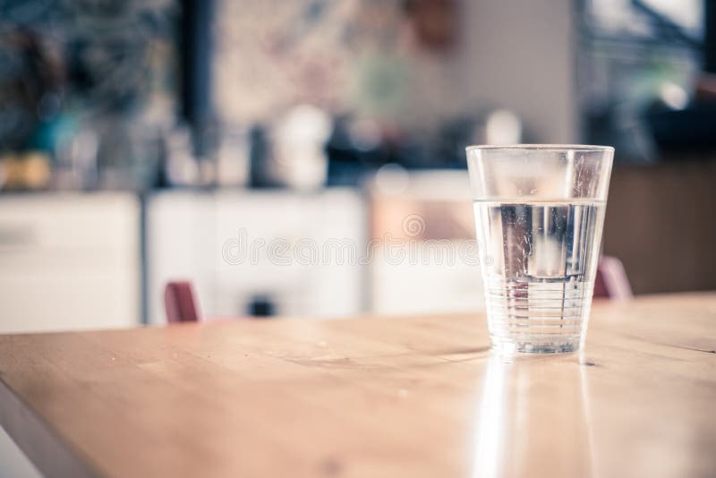 Clear Glass of Fresh, Cold Water on the Kitchen Table Stock Photo ...