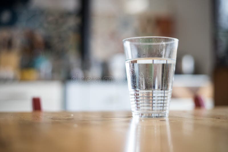 Clear Glass of Fresh, Cold Water on the Kitchen Table Stock Photo ...