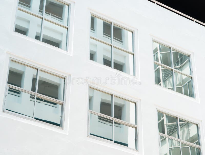Clear Glass Window on the White Wall of High Architecture Building ...