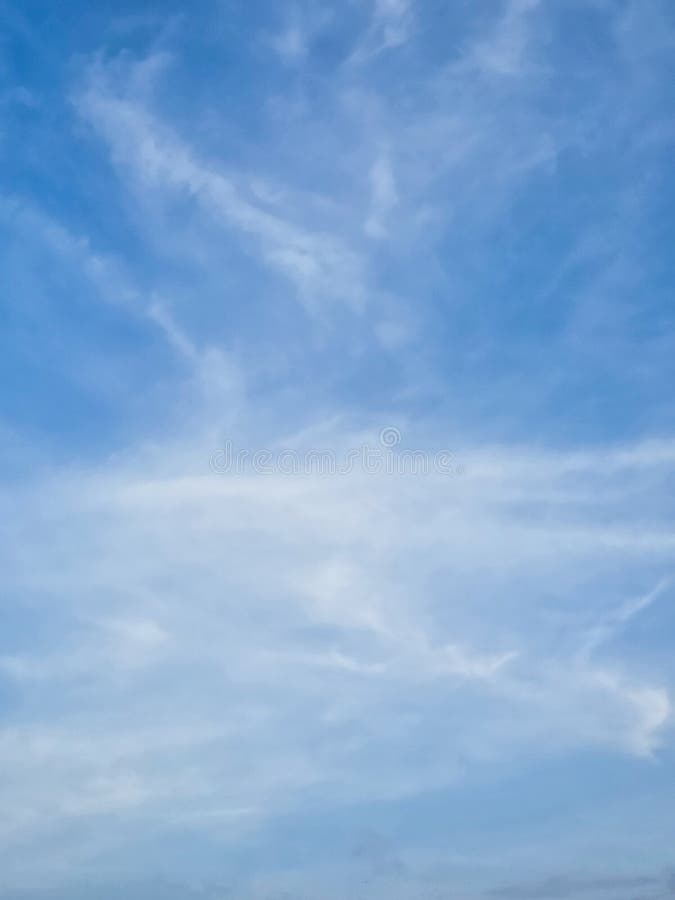 Clear, High-altitude Clouds Drift Across a Vibrant Azure Sky Stock ...