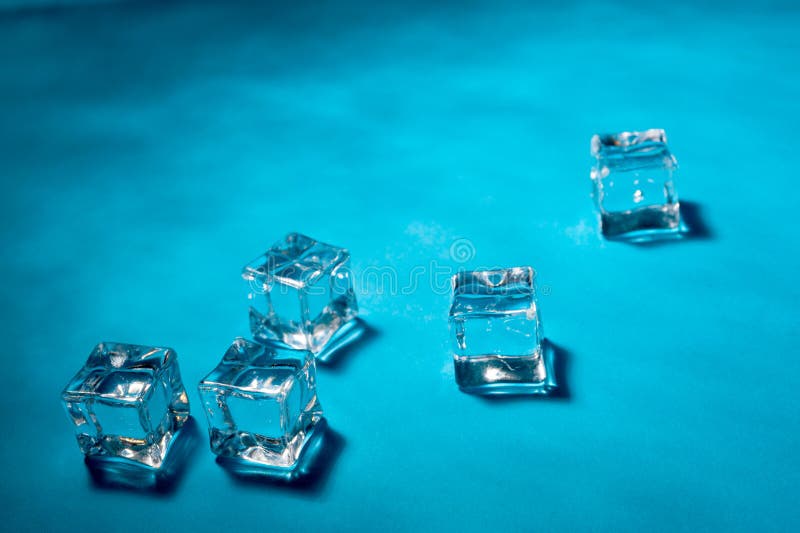 Clear Ice Cubes for Cooling Drinks on a Blue Background Stock Image ...