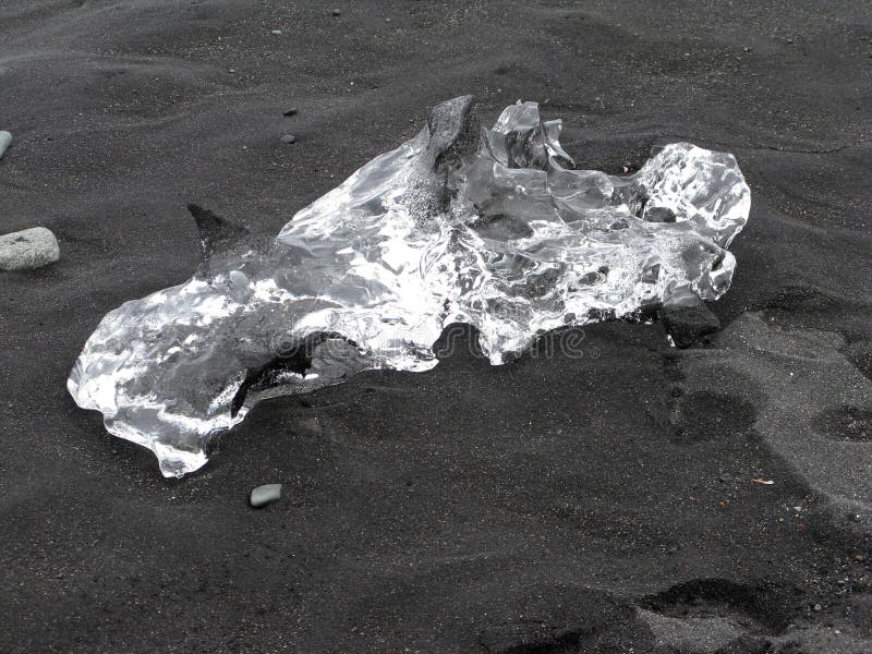 Clear Ice on Volcanic Beach Stock Photo - Image of volcanic, reflection ...