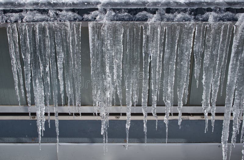 Clear Icicles Dripping Water from Eaves at Springtime Stock Image ...