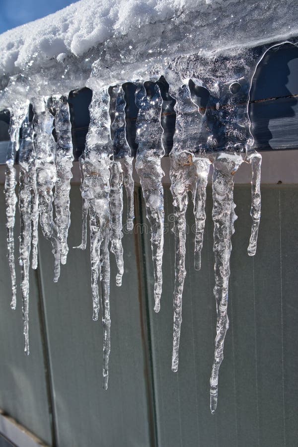 Clear Icicles Dripping Water from Eaves at Springtime Stock Image ...