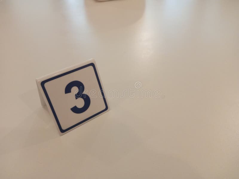 Table Number 3 Sign on a White Surface – Restaurant Queue Marker Stock ...