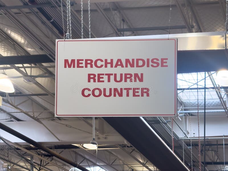 A Clear "MERCHANDISE RETURN COUNTER" Sign Hangs in a Large Retail Space ...
