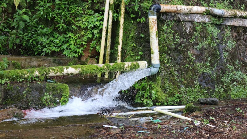 Clear Mountain Spring Water Flows Freely from the Pipe Stock Image ...