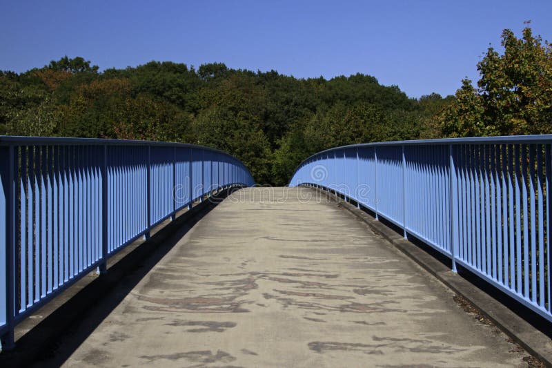 Symmetrical View of a Pedestrian Bridge into a Forest Stock Photo ...