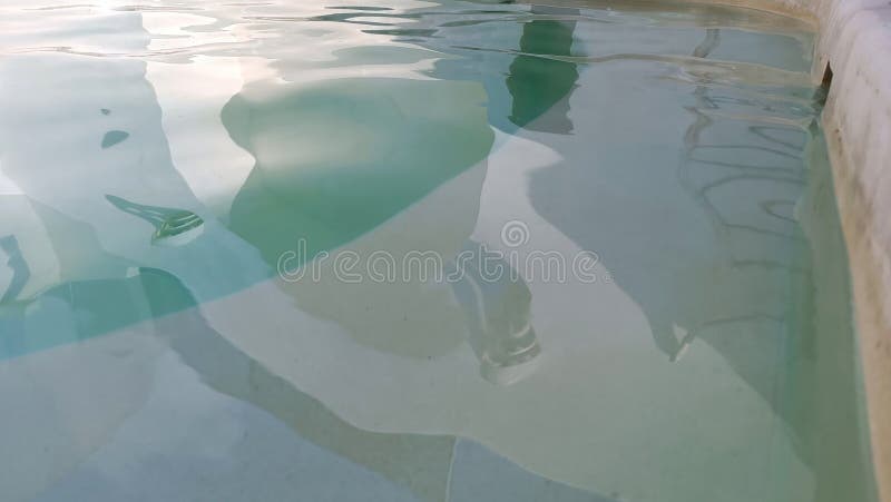 Clear Pool Water with Reflection of Stone Wall Stock Image - Image of ...