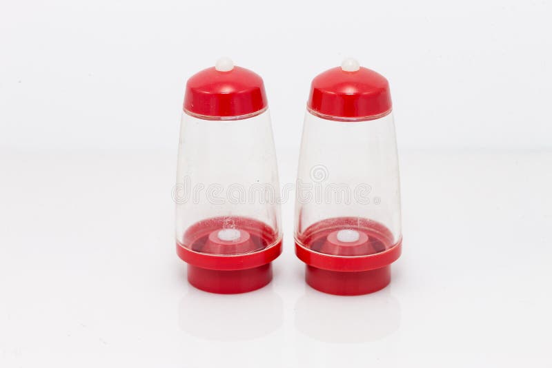 Clear with Red Top and Bottom Salt and Pepper Shakers Stock Photo ...