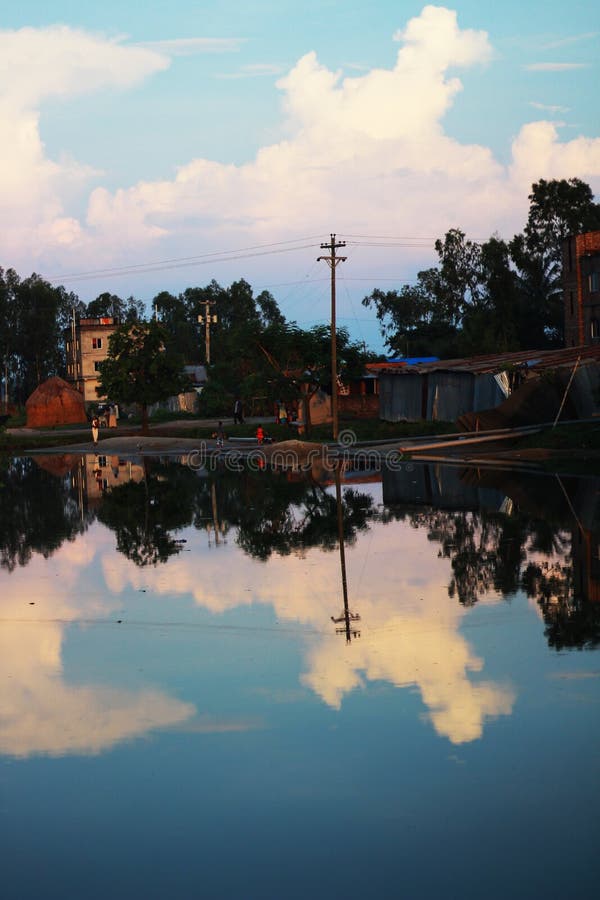 Clear Reflection of a Small Village in the Water of a Lake Stock Image ...