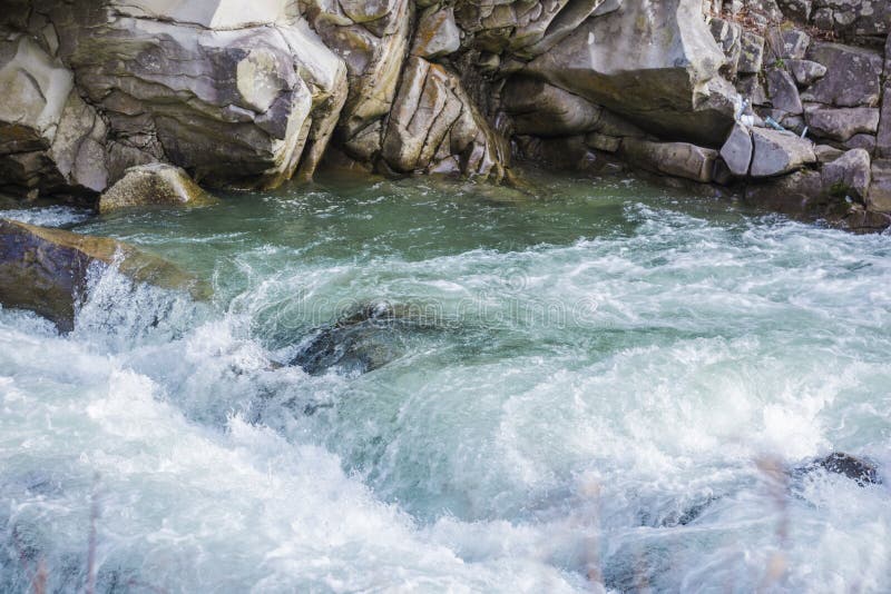 Clear River with Rocks Leads Towards Mountains, Small Waterfall Stock ...