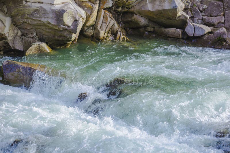 Clear River with Rocks Leads Towards Mountains, Small Waterfall Stock ...
