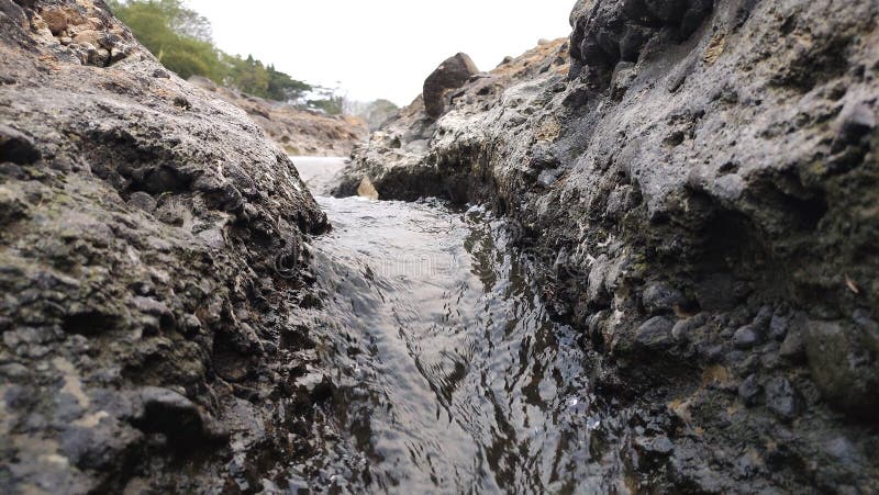 Clear River Water Flowing between the Rocks Stock Image - Image of ...