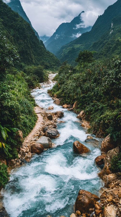 A Clear River Winds Gently through a Verdant Valley, Flanked by Steep ...