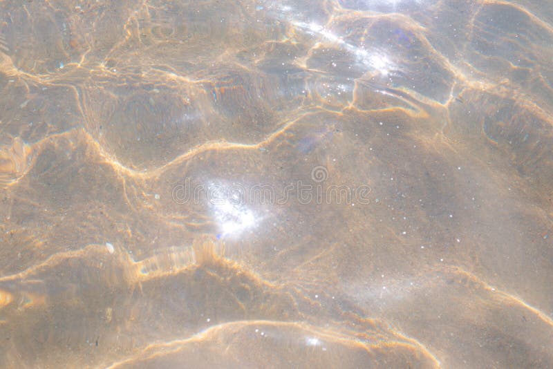 Clear Sea Water with Waves and Sun Reflection on the Sandy Bottom ...