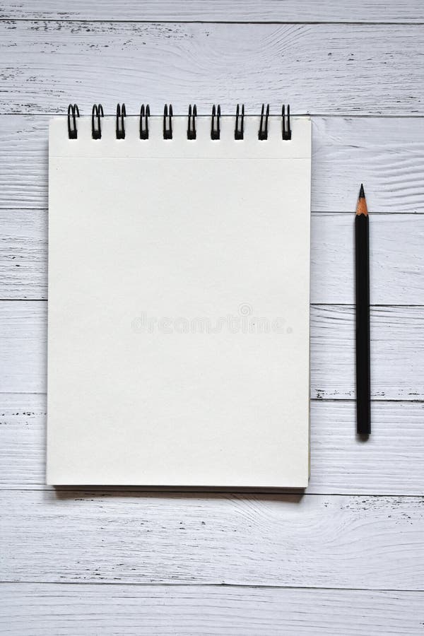 Clear Sheet Note Book and Black Pencil on White Wood Background. Stock ...