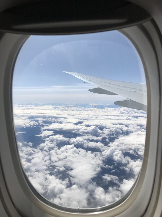 The Clear Sky and Pretty Clouds Looking Out of the Window during the ...