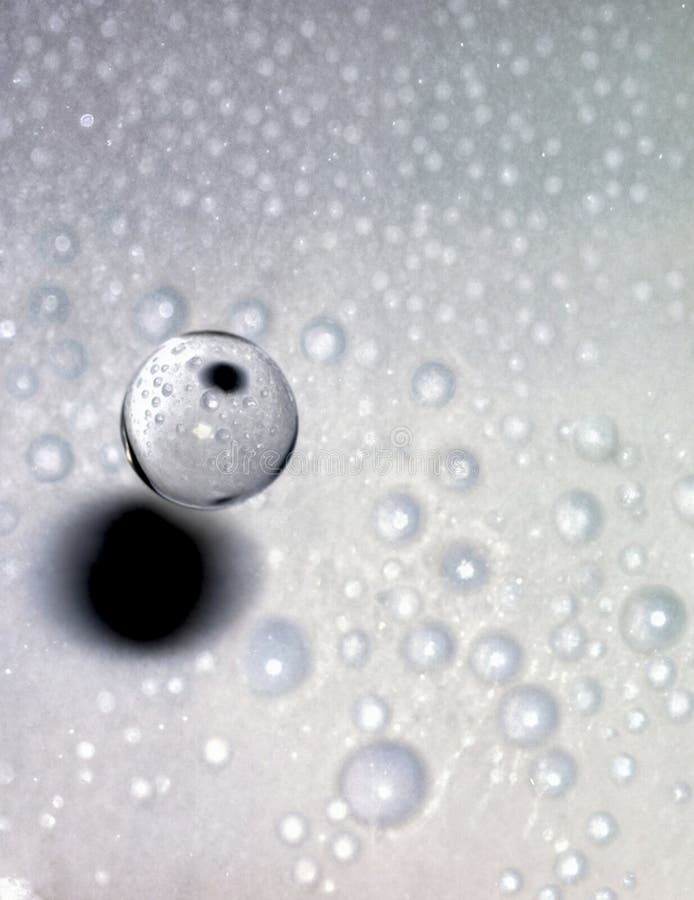 A Clear Sphere of Water Drop with a Black Shadow on it Stock Image ...