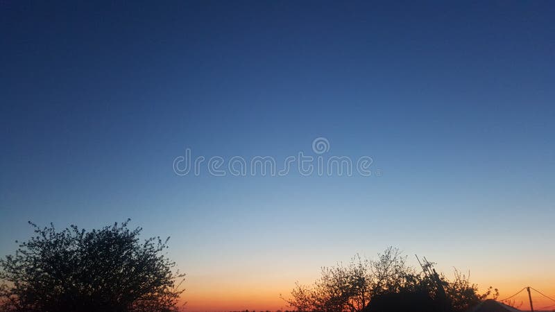 Clear sunset sky stock image. Image of reflection, dusk - 260891055