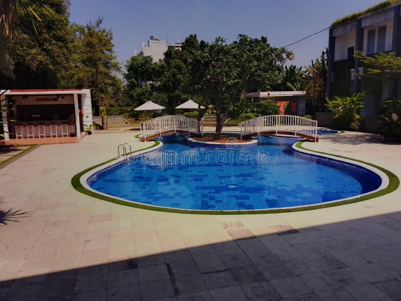 Clear Swimming Pool with Garden View and Charming Hotel Building Stock ...