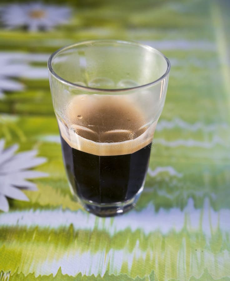 Clear Translucent Glass with Black Coffee and Foam Stock Photo - Image ...
