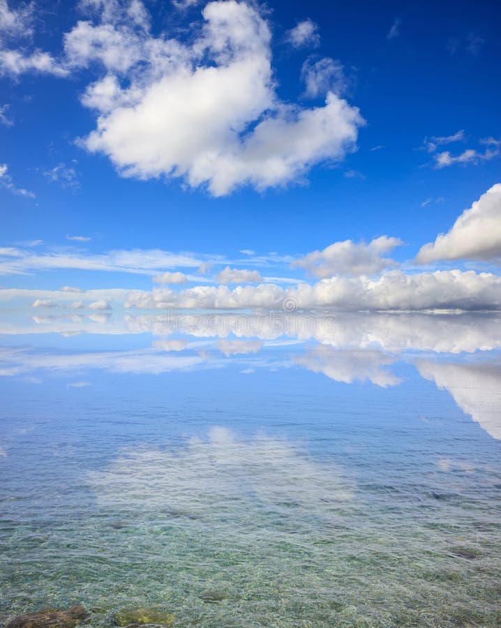 Clear Sea Surface. Shallow Water, Blue Sky with Clouds Background Stock ...
